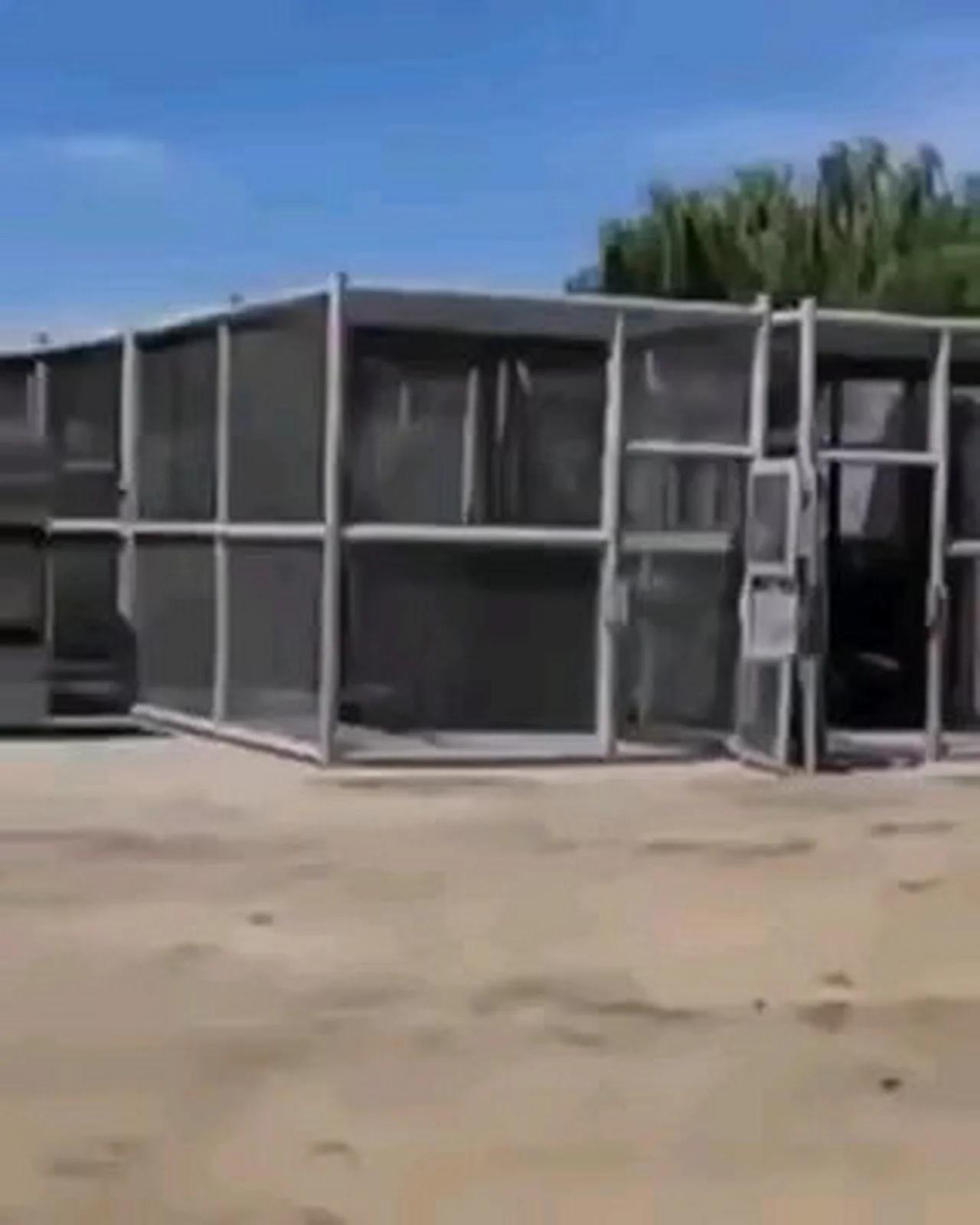 Fields of human cages in Caruthers, CA