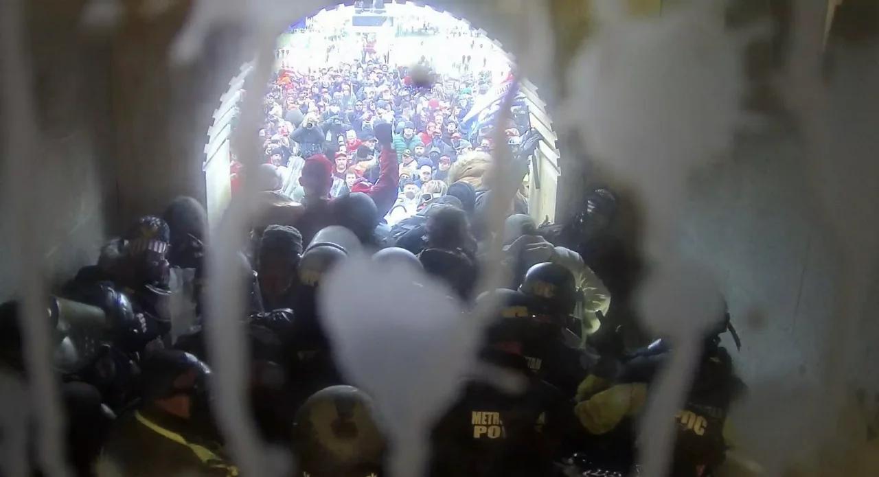 RF45 with a collapsible stick, a riot shield, reaches into a MPDC bag ...