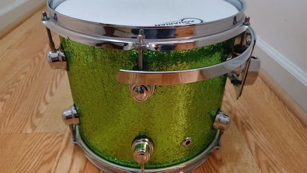 Wrapping a drum set in vinyl glitter for a vintage look. #diy #drums # ...