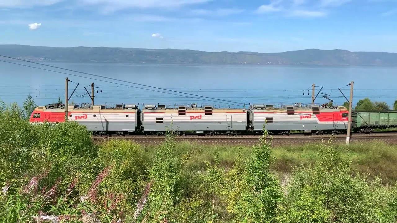 Lake Baikal. Russian freight trains against the backdrop of nature in ...