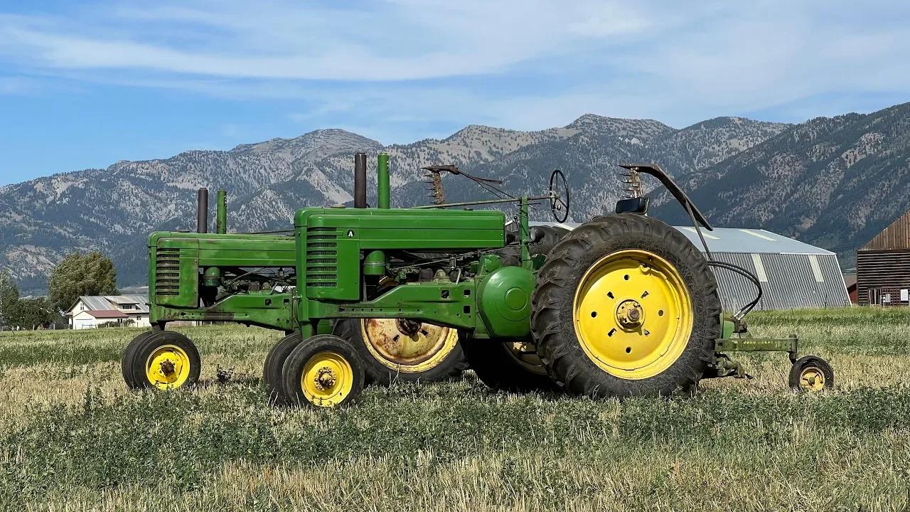 Two John Deere Model A Tractors and Numbers 5 and 38 Mowers Side-By-Side