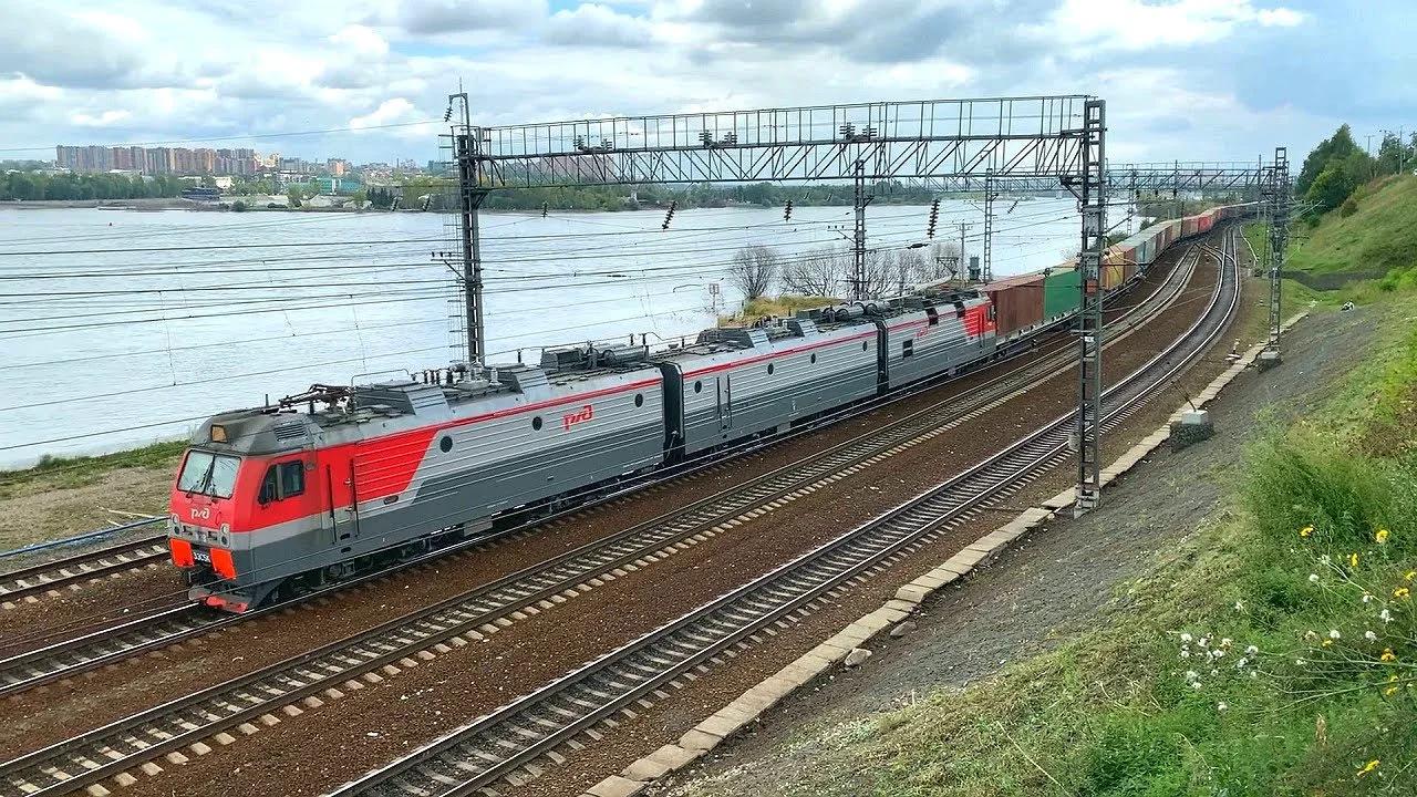 Russian freight trains in Irkutsk along the Angara river. Railway in ...