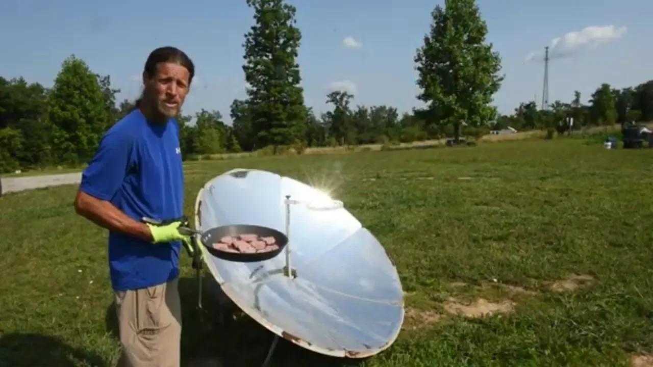 Solar cooking. Cooking with the sun using a Parabolic dish.Alternative ...