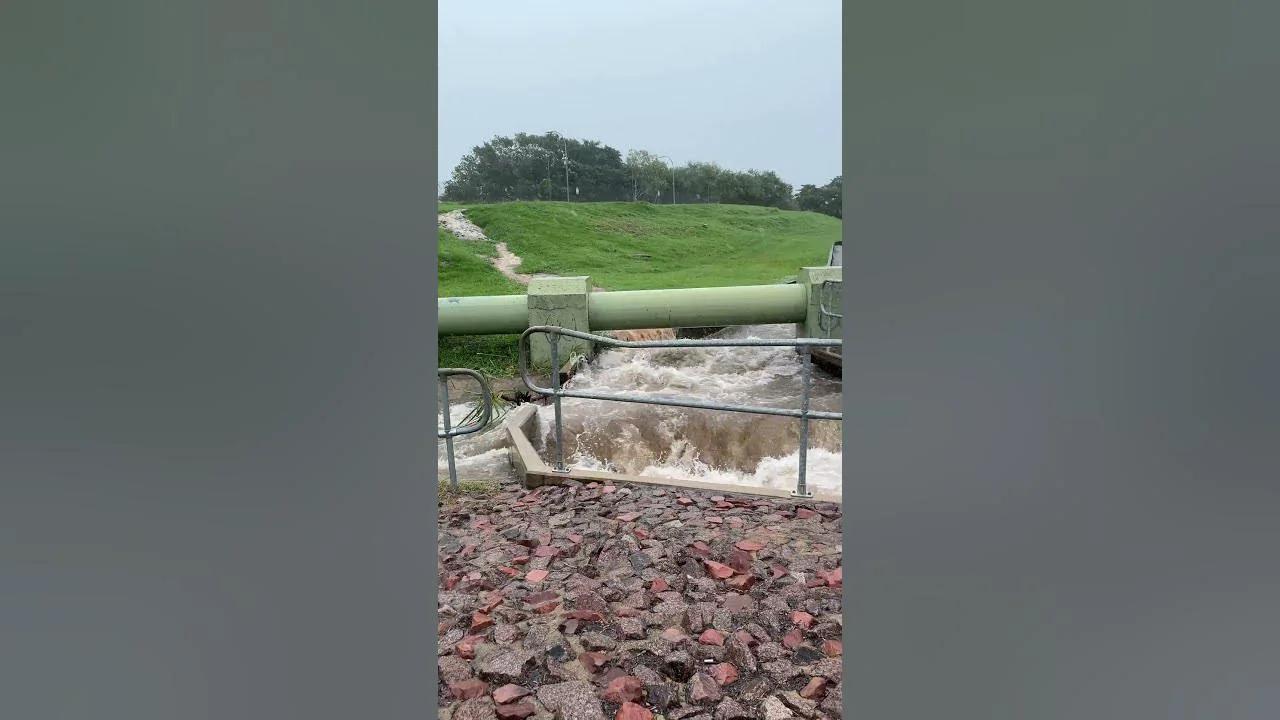 Stormwater drain overflowing in monsoonal rain storm