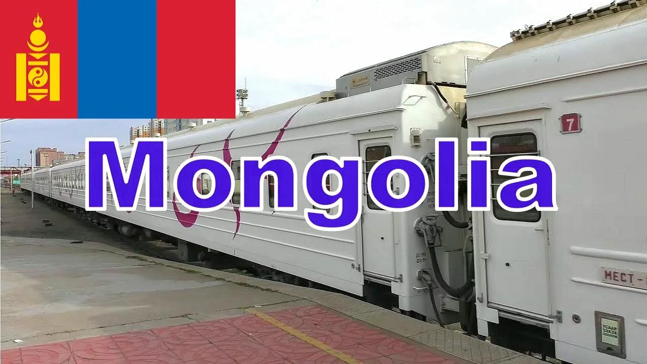 White mongolian train from China. Russian passenger train in Mongolia. Locomotives