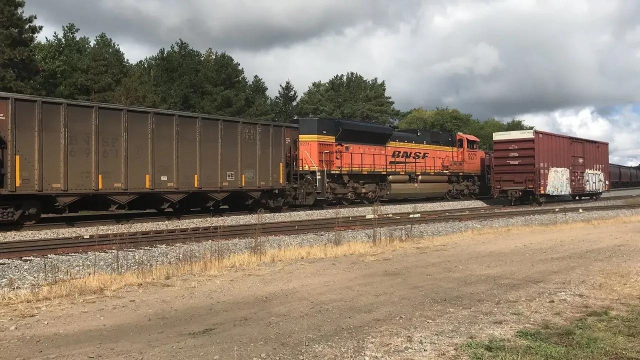 BNSF Empty Coal Westbound Passing by a Grain Train