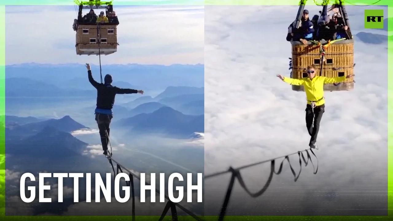 Holding the balance! | Slackliners walk between balloons at a ...