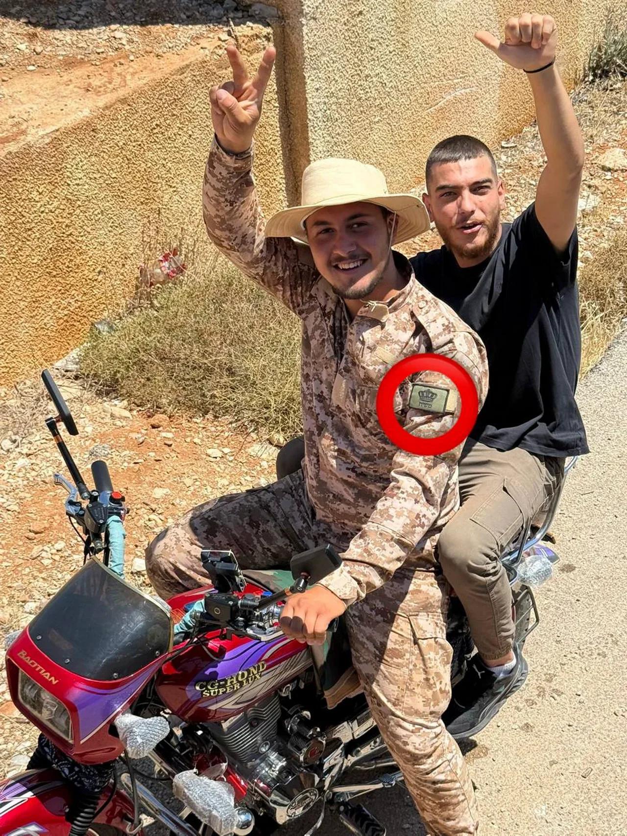 A photo taken today in Syria shows a person in military uniform wearing ...