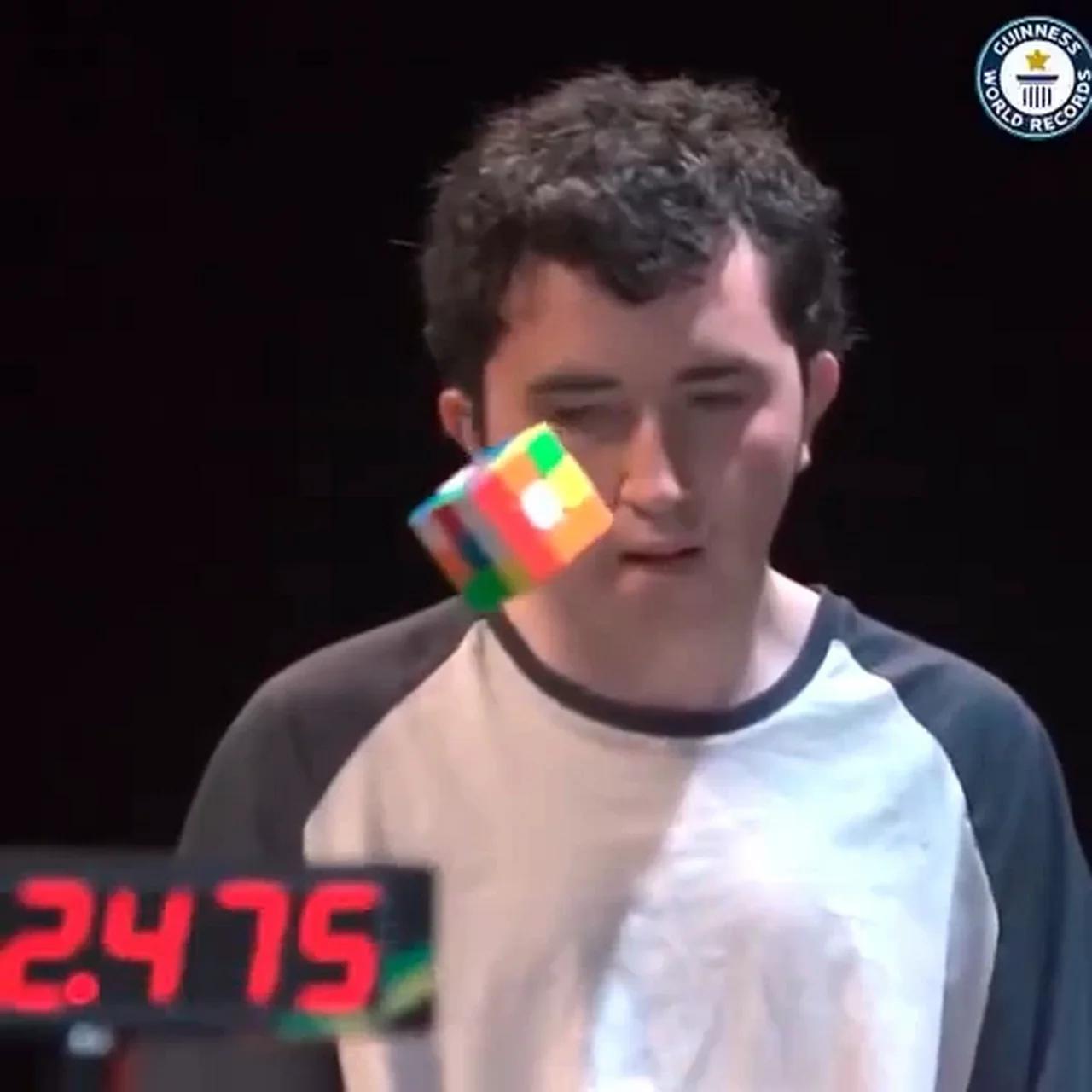 Colombian Angel Alvarado solves three Rubik’s Cubes while juggling them