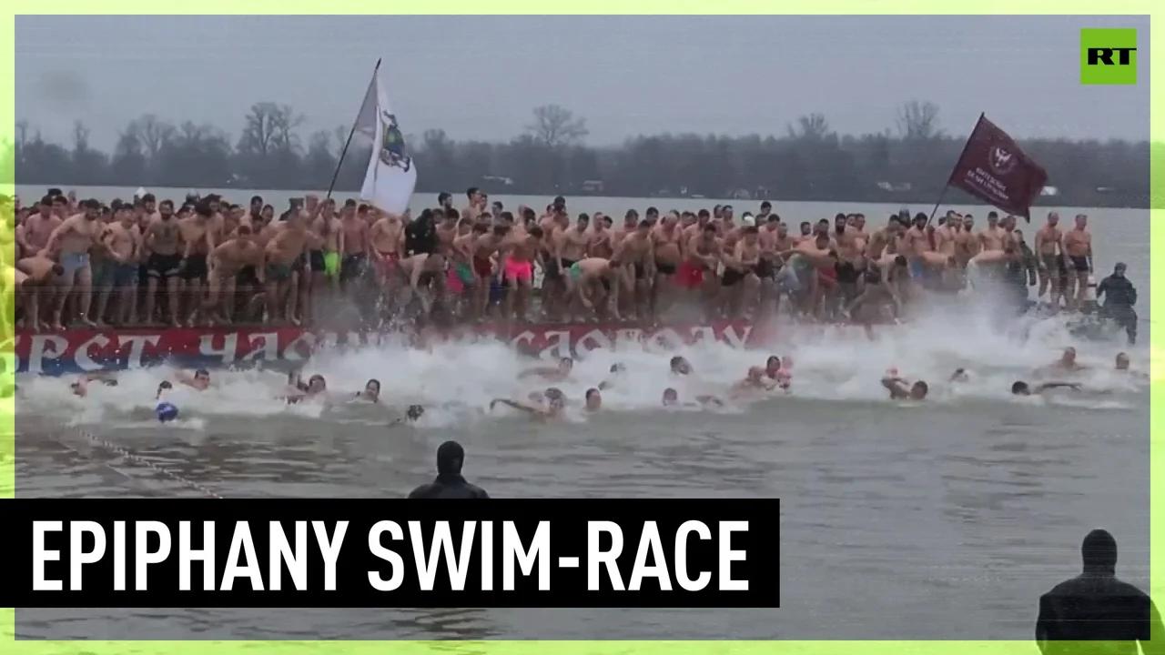 Orthodox Christians celebrate Epiphany with traditional swim-race in Danube
