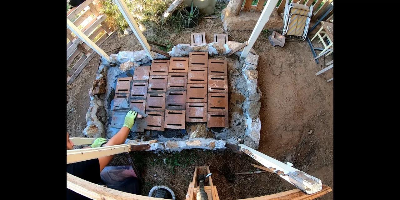 Building fire place with stones, wood and cob