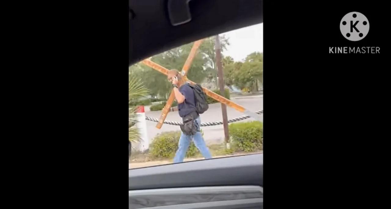 RE_I SAW A CHRISTIAN DRAGGING A CROSS IN THE STREET!!