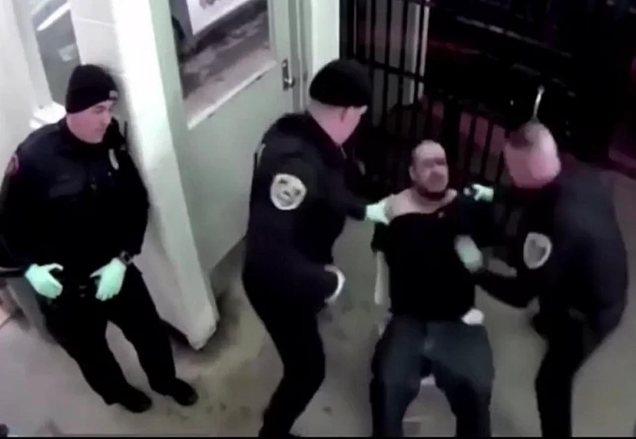 Handcuffed Man Spits on Two Police Officers, Face Gets Caved in with ...
