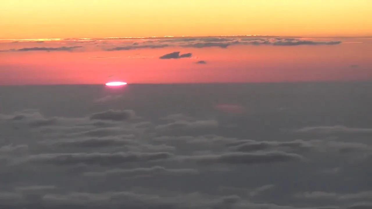 Sun Rising Out Of Clouds In Front Of Horizon - Proof Of The Local Sun