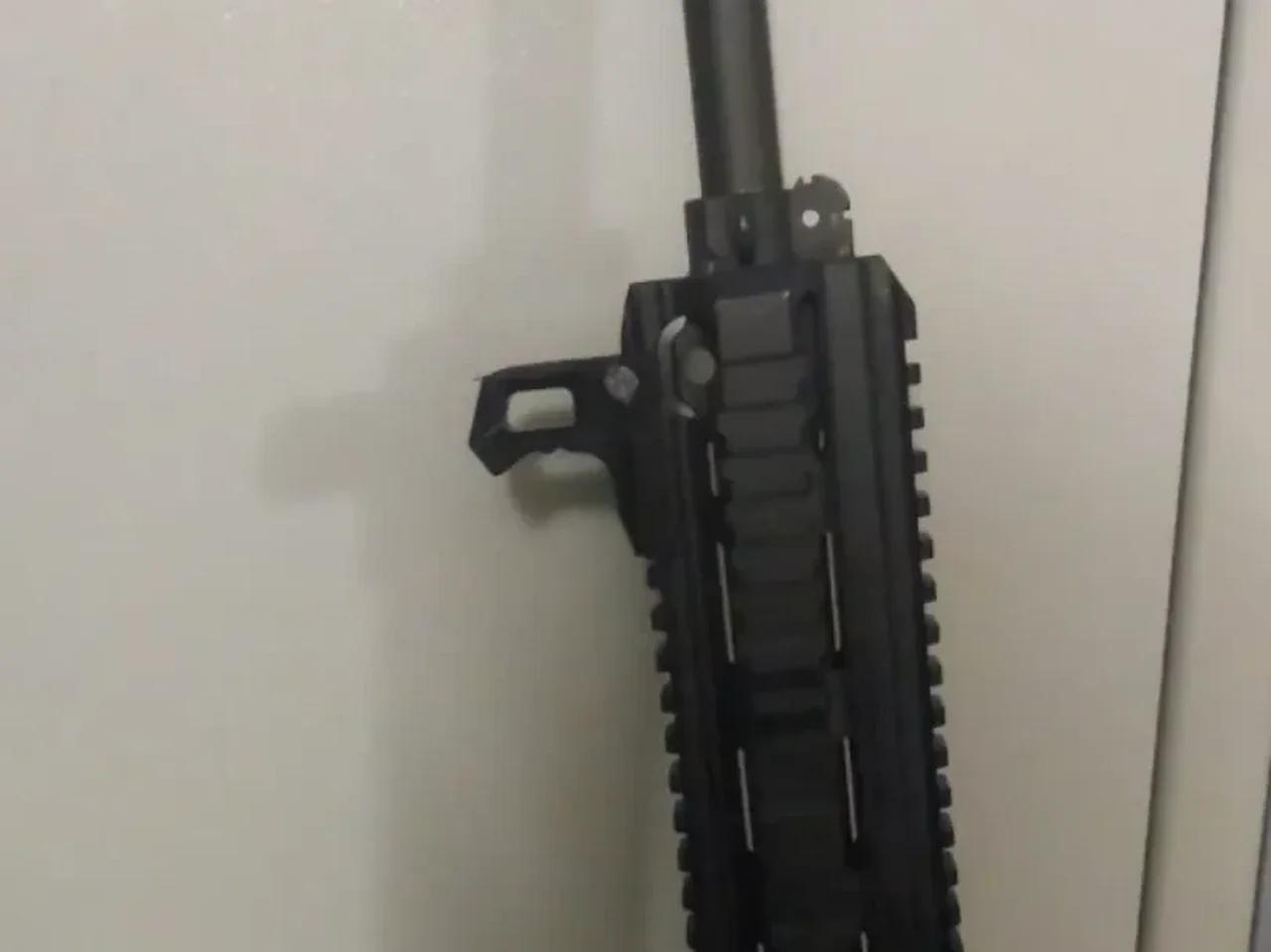Tactical finger stop for C-Clamp grip mounted on picatinny rail.