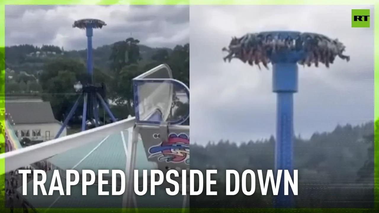 Dozens dangle upside down high on a ride in Portland amusement park